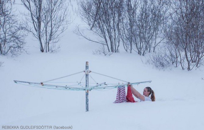 Woman Hangs Laundry in Heavy Snowfall - DongA Science